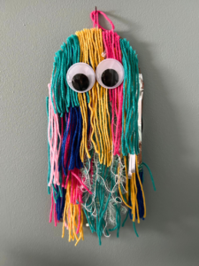 How to Make a Wooly Monster Yarn Wall Hanging